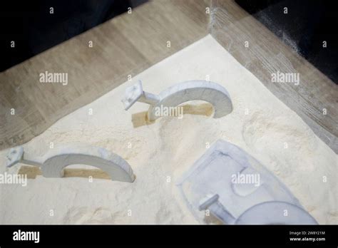 Objects Printed On A 3d Printer From Powdered Polyamide Lying In White Polyamide Powder Models