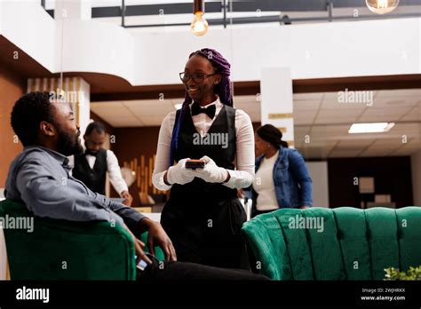 Friendly African American Female Waitress Taking Order Serving Hotel