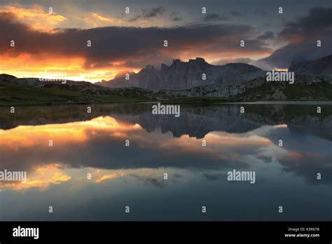 Dolomites Italy Clouds And Colors At Dawn Reflected In Laghi Dei