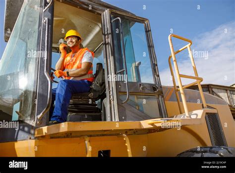 Multiracial Man Working Hard At Construction Industry Plant Stock Photo Alamy