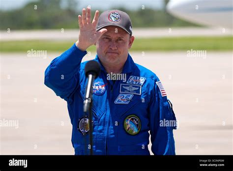 Pilot Mike Fincke Of Nasa Waves To Media After Arriving At The
