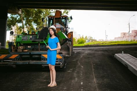 Premium Photo Female Architect Standing Against Vehicle