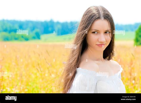 Beautiful Young Russian Girl In A Field With Gold Ears Of Wheat Stock
