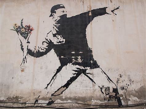 Man Throwing Flowers By Banksy In Beit Sahour Israel Tripomatic