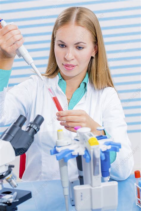 Lab Assistant Using Pipette Stock Image F Science Photo Library