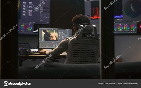 experienced african american video maker does color grading program
