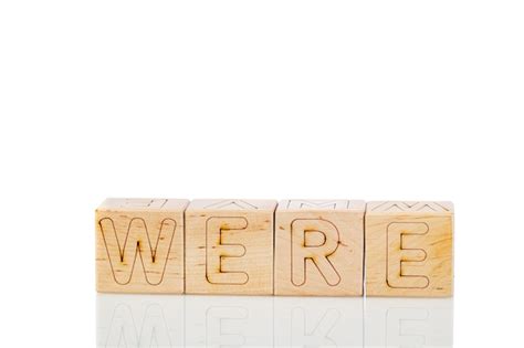 Premium Photo Wooden Cubes With Letters Were On A White Background