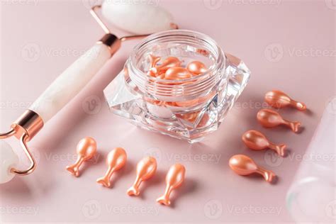 Pink Quarts Face Roller And Single Dose Serum Capsules In A Package