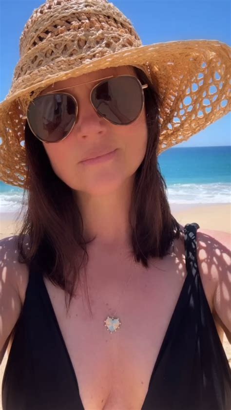 90s Star Tiffani Thiessen 50 Stuns In Black Tank Top And White Skirt
