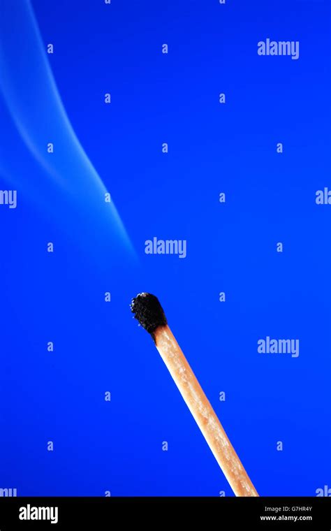 Extinguished Match With Smoke On Blue Background Stock Photo Alamy