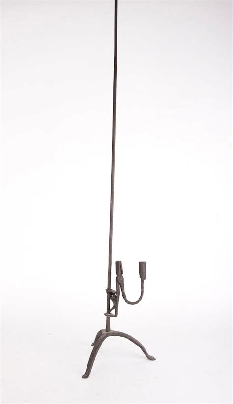 Bonhams A Pair Of Wraught Iron Rush Nips On Stand