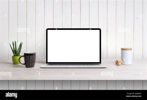 Lapop On Desk With Isolated White Screen For Mockup App Or Web Page Design Promotion White