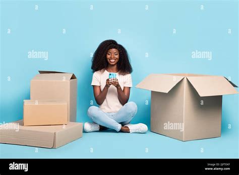 Full Body Photo Of Cheerful Pretty Person Sit Floor Hands Hold