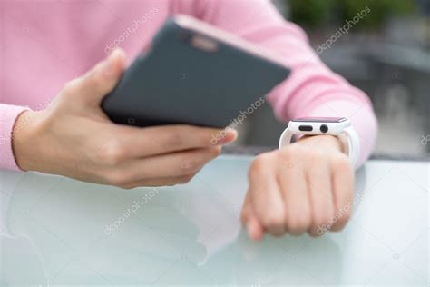 Woman Connecting Smart Watch And Cellphone Stock Photo Leungchopan 105579626