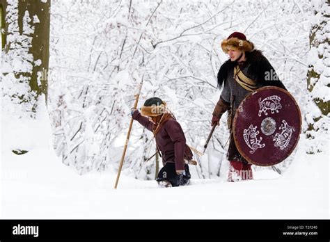 Father And Son Vikings In A Deep Winter Forest And The Father Teaches