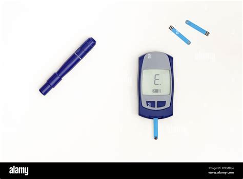 Top View Of Glucometer With Letter E Error Result On Display With