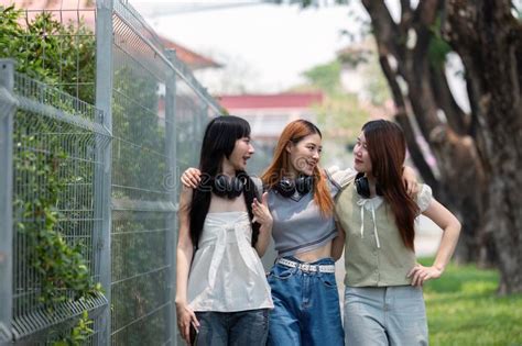 College Friends Walk To Class Together University Student In Campus Talk And Have Fun Outdoors