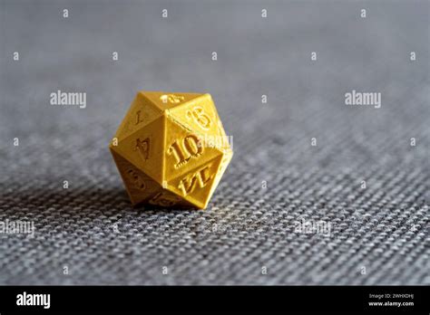 Golden 3d Printed D20 Rpg Game Dice On A Bed Object Macro Detail Extreme Closeup Nobody