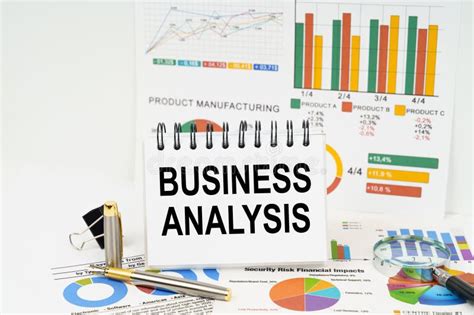 On The Table Are Reports With Graphs And A Notepad With The Inscription Business Analysis