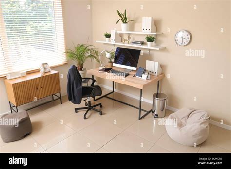 Stylish Interior Of Office With Workplace Modern Computer And Armchair