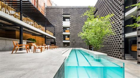Jsa Lines Hotel Carlota Courtyard With Black Concrete Blocks