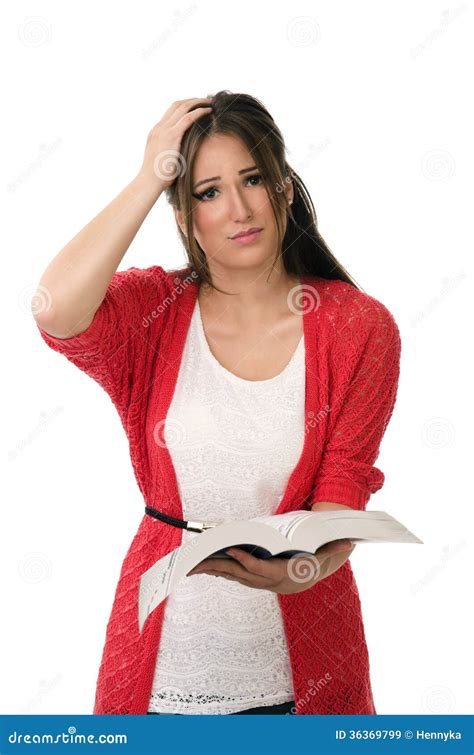 Confused студент читая книгу Стоковое Изображение изображение