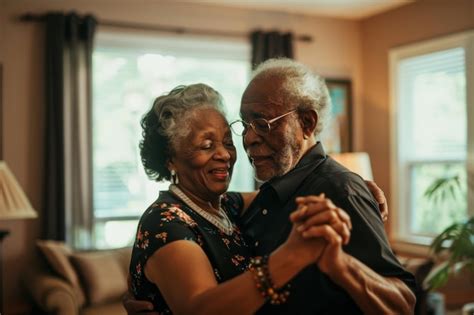 Premium Photo Senior Couple Dancing In Their Living Room