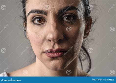 Beautiful And Sad Woman Crying Desperate And Depressed With Tears On