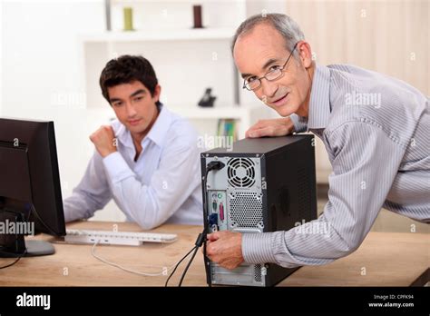 Man Fixing A Computer Stock Photo Alamy