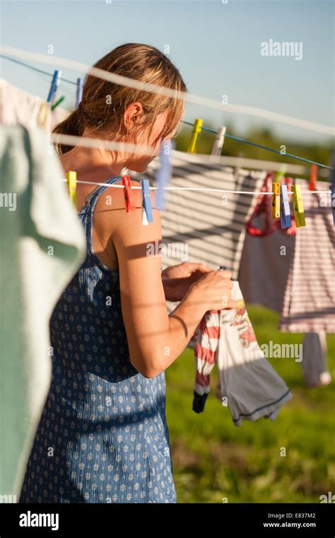 Woman Sorting Out Clothing Hi Res Stock Photography And Images Alamy