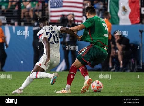 USA forward Folarin Balogun 20 and Mexico defender César Montes 3