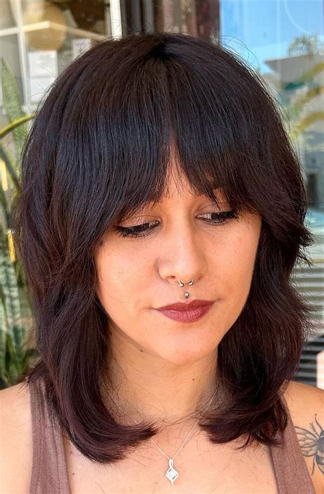Shoulder Length Shag Haircut With Full Textured Bangs