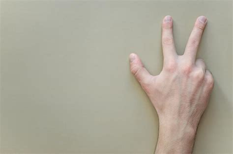 Premium Photo A Young Man Shows Gestures Of The Deaf And Dumb The