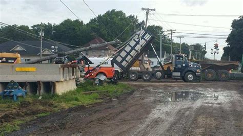 Dump Truck Pulls Down Wires In Gates