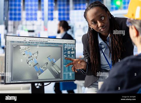 Solar Panels Plant Teamworking Colleagues Looking Over Factory Energy Consumption On Computer