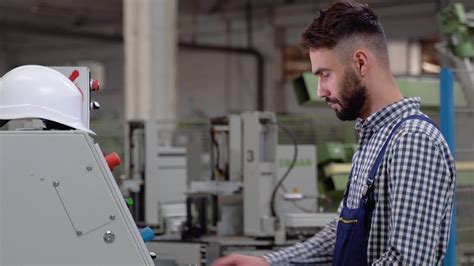 Industrial Programmer Checking Control Box Status With Computer