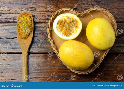 Yellow Passion Fruit And Passion Fruit Cut In Half In Heart Shaped