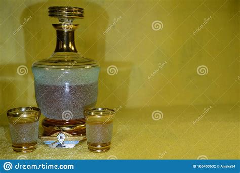 Still Life With A Decanter Glasses Of Wine And A Military Badge