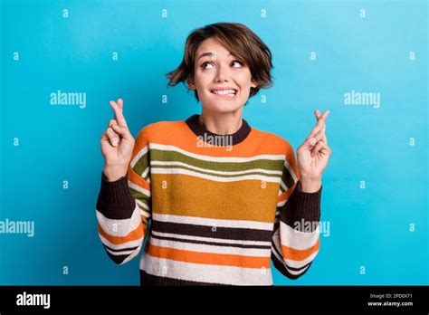 Photo Of Doubtful Unsure Woman Dressed Pullover Biting Lip Fingers