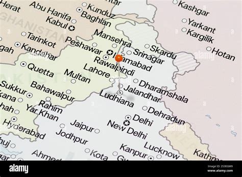 Macro Photo Of An Orange Pin Needle Into Ludhiana City Of India