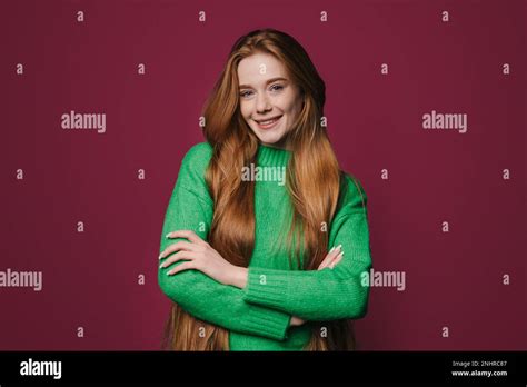 Cheerful Young Woman With Ginger Long Hair Smiling Happily While