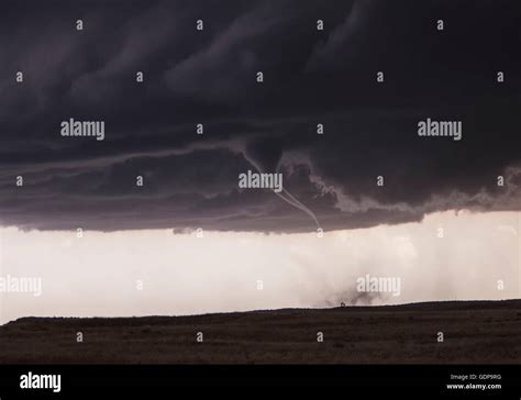A Tornado Touches Down With A Tree Stock Photo Alamy