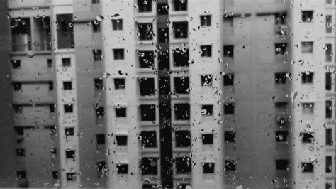 Premium Photo Building Seen Through Wet Glass
