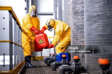 Factory Workers Handling Dangerous Chemicals Or Acids Inside Chemical