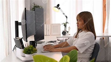 Concentrated Female Software Developer Checking Mistakes In Programming