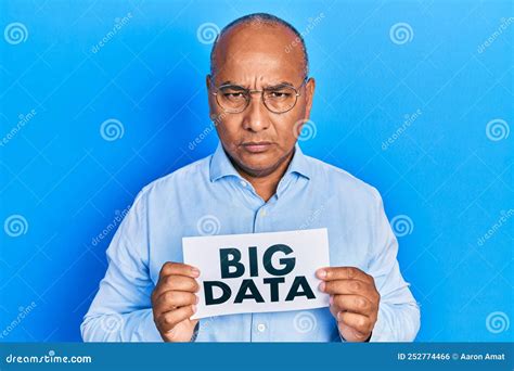 Middle Age Latin Man Holding Paper With Big Data Message Depressed And