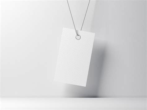 Premium Photo Empty Tag Label Mockup Tied On Rope Against White Wall