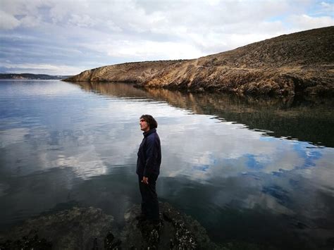 Premium Photo Side View Of Man Standing Against Sea At Beach