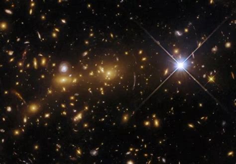 Hubble Telescope Reveals Massive Galaxy Cluster Cosmic Monster In