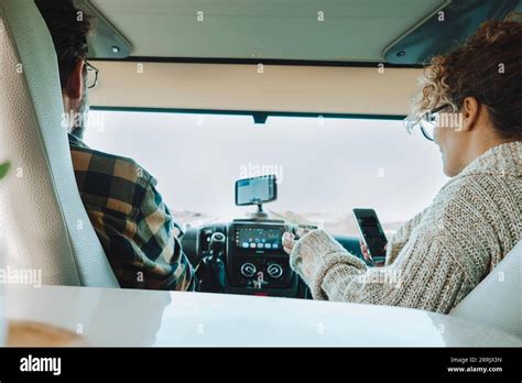 Inside Back View Of Vehicle Cabin Like Motorhome And Couple Traveling